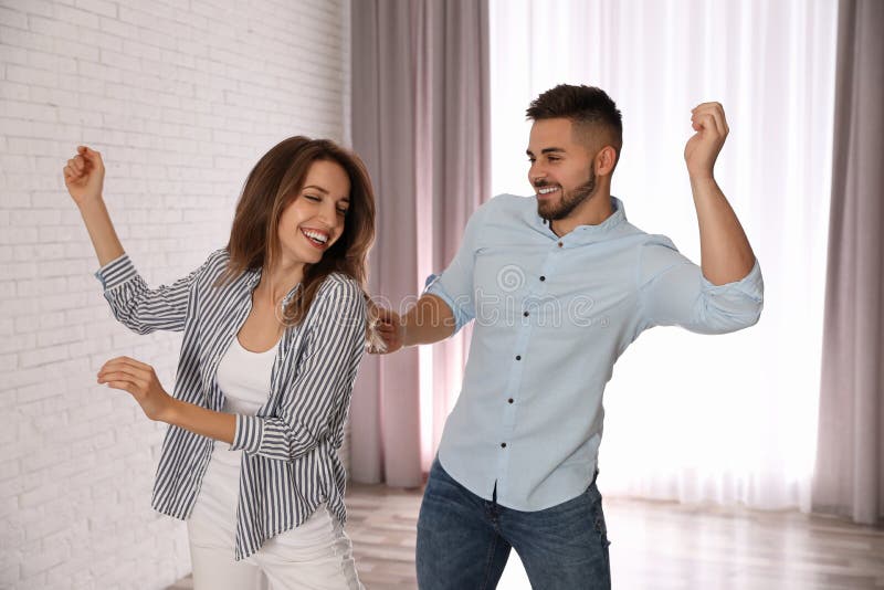 Lovely Young Couple Dancing Together Stock Image - Image of empty ...