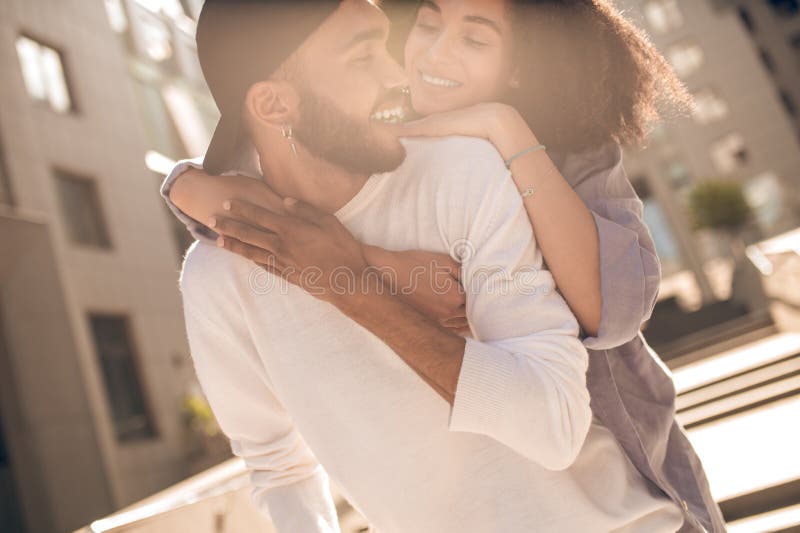 Lovely Young Couple in Sunlight Looking Happy Stock Photo - Image of ...
