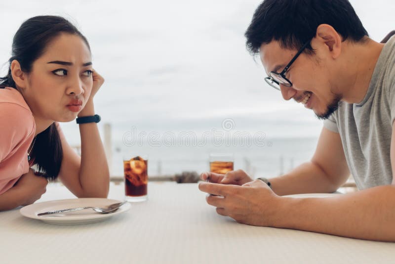 Lover Couple is Having a Bad Date at the Restaurant on the Beach Stock ...
