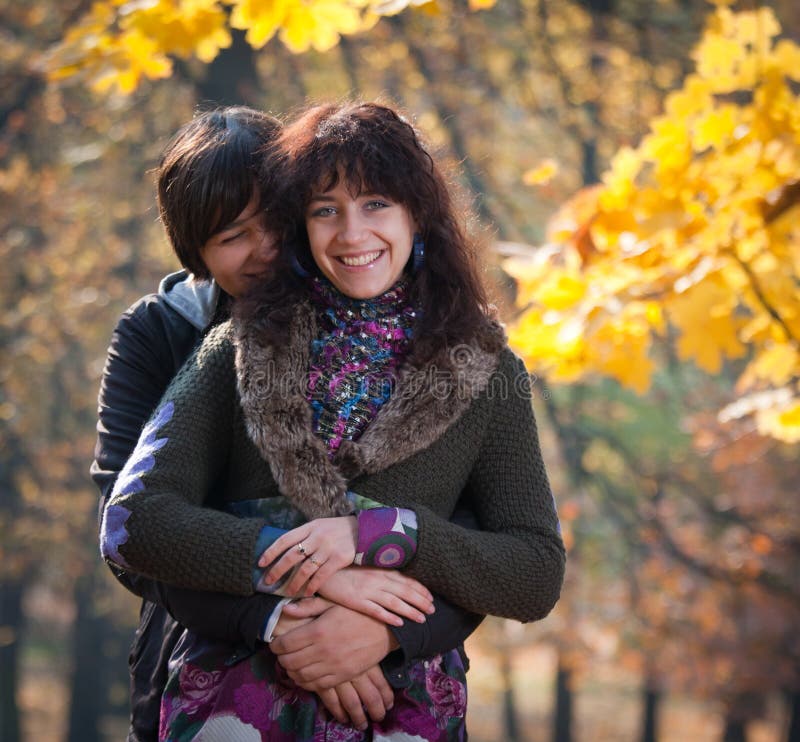 Lovers during autumn stock image. Image of park, romancelovers - 26892577