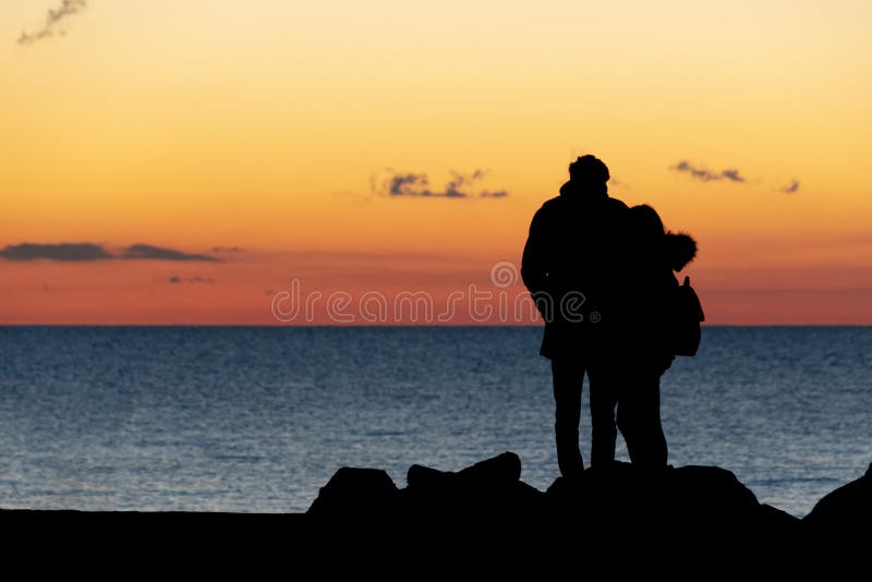 Lovers Hugging in Front of the Sea at Sunset Stock Image - Image of ...