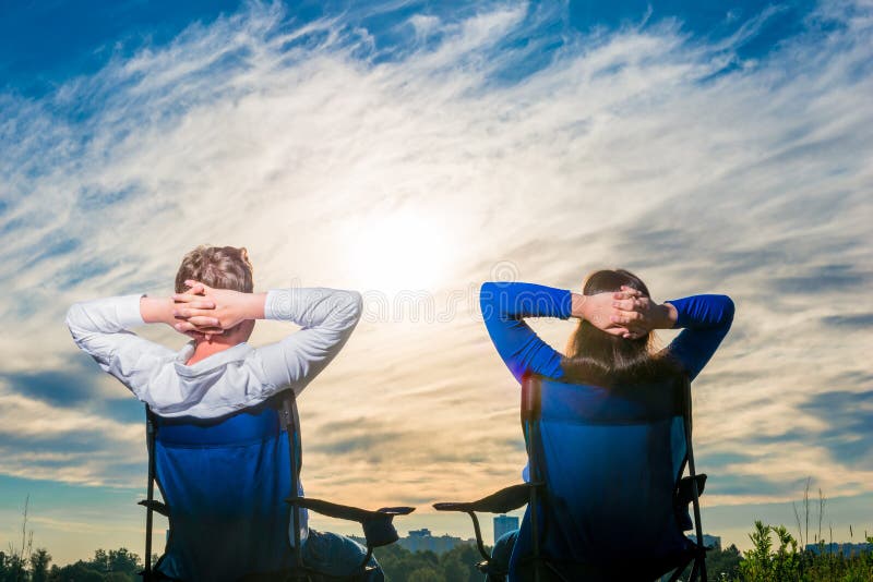 Lovers Sit on the Chairs and Look at the Beautiful Sky Stock Image ...