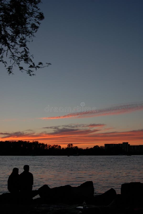 Lovers at Sunset stock image. Image of summer, lake, river - 5871537