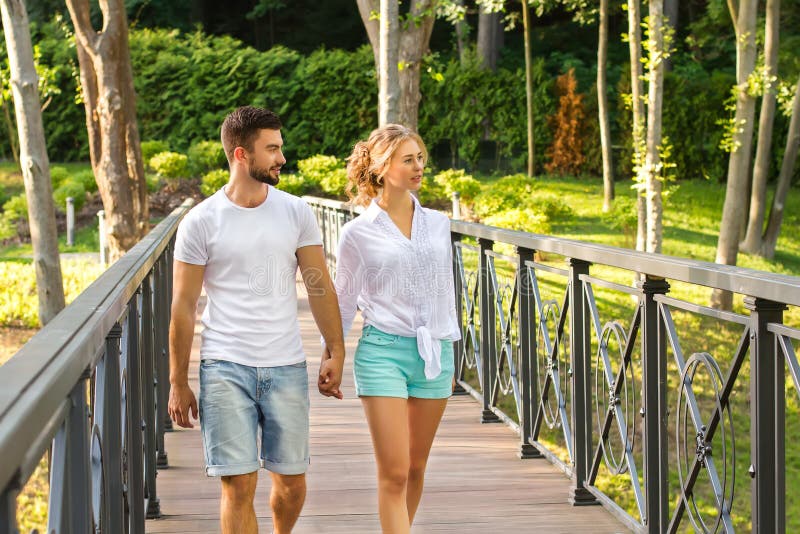 Lovers walk in the park. stock image. Image of cheerful - 63101989