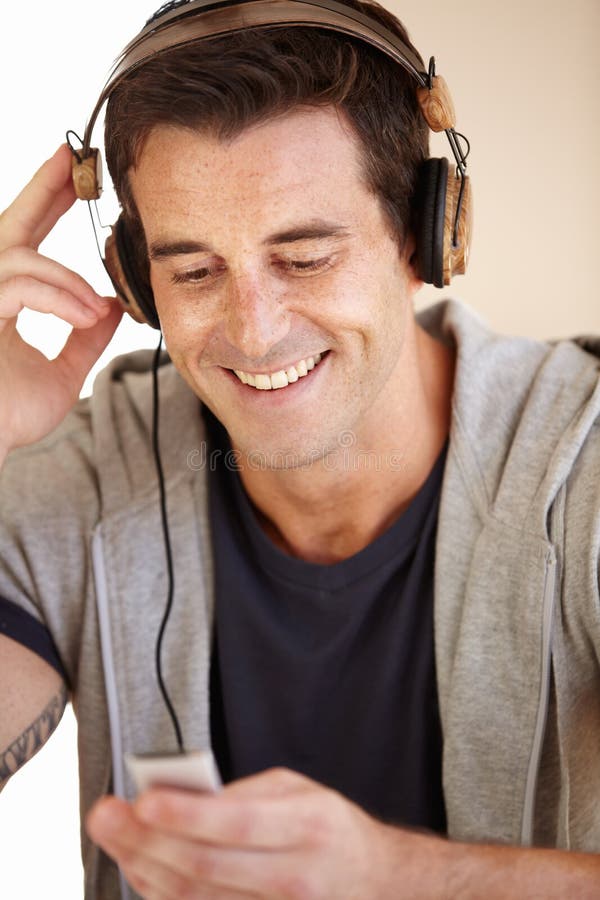 He Loves His Tunes A Handsome Young Man Listen To Music Through His