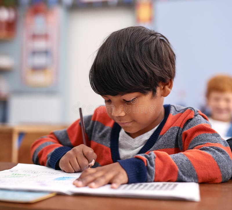He Loves Writing. Elementary School Children in Class. Stock Photo ...