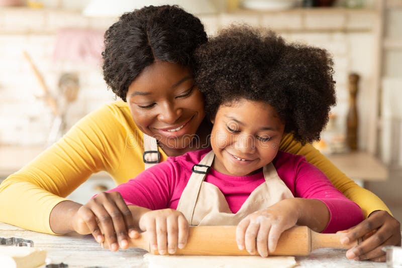 Loving Black Mom Teaching Her Little Daughter How To Roll Dough Stock ... Loving Black Mom Teaching Her Little Daughter How To Roll Dough Stock ...