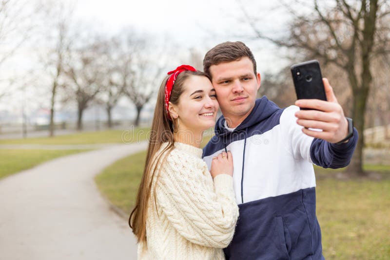Loving Cheerful Happy Couple Taking Selfie In The City Capturing Happy