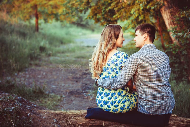 Lovers Sitting by the Water on the Bench Stock Photo - Image of ...