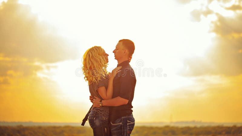 Loving Couple Hugging at Sunset. Stock Photo - Image of relaxation ...