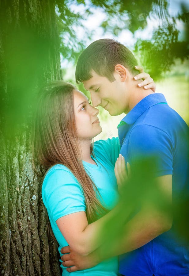 Loving couple near a tree stock photo. Image of male - 43160508