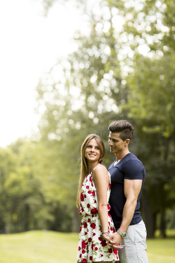 Loving couple in the park stock photo. Image of together - 76337888