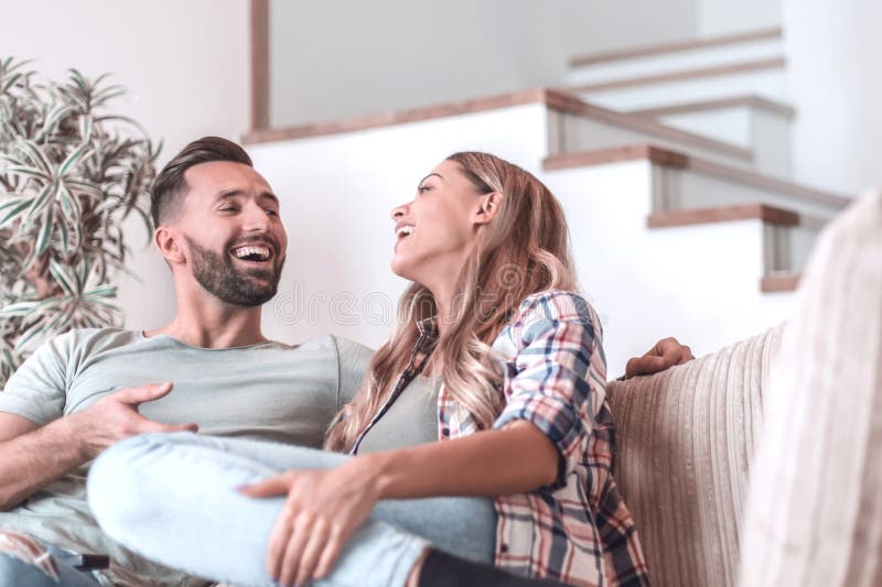 Loving Couple Relaxing on the Couch on a Free Evening Stock Photo ...