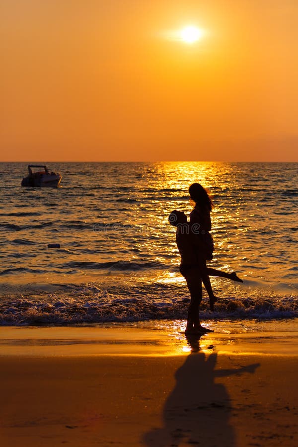 Loving Couple at Sunset in the Sea Stock Image - Image of black, pair ...