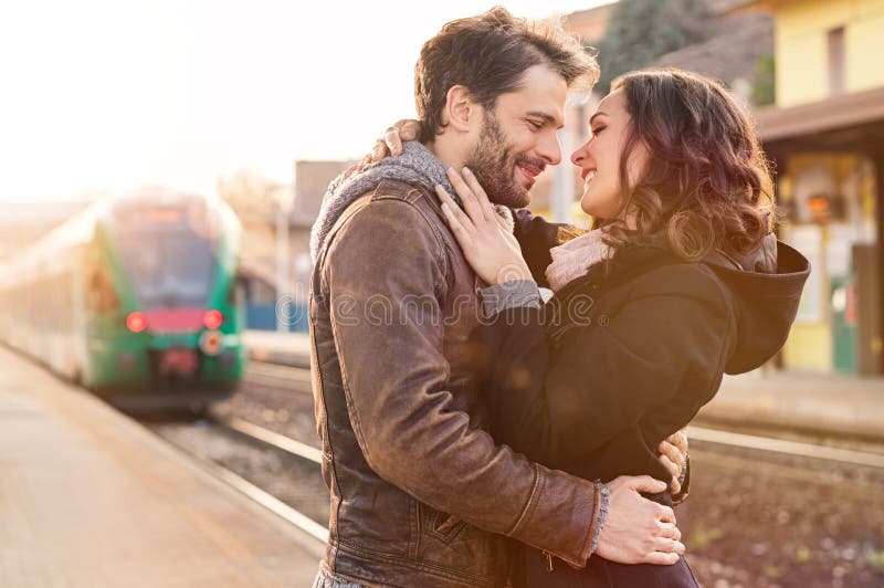Loving Couple at Train Station Stock Photo - Image of people, hugging ...