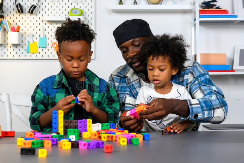 Loving Father Teaches and Plays with Son at Home for Learning and ...