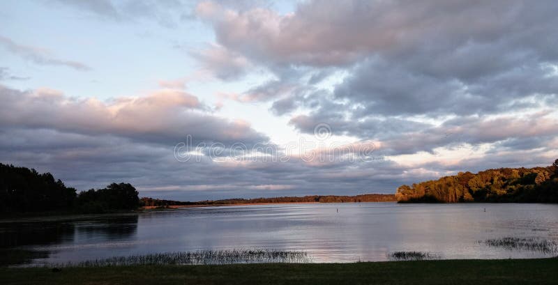 Loving the Lake Life stock photo. Image of sunset, shore - 225584162
