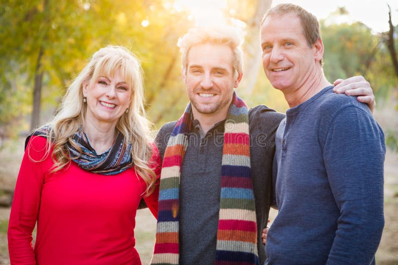 Loving Middle Aged Parents and Adult Son Portrait Outdoors Stock Photo ...