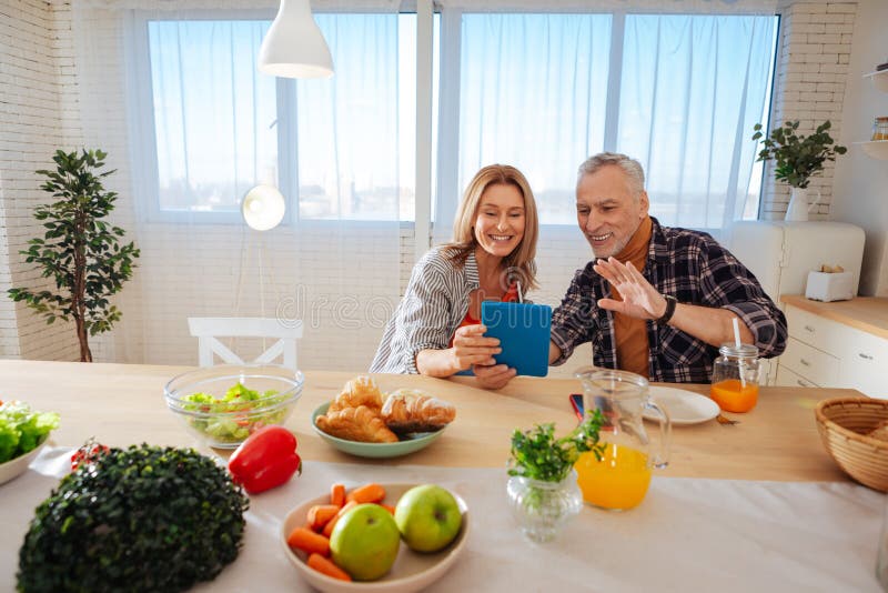 Loving Parents Smiling Having Video Chat with Their Son Stock Photo ...