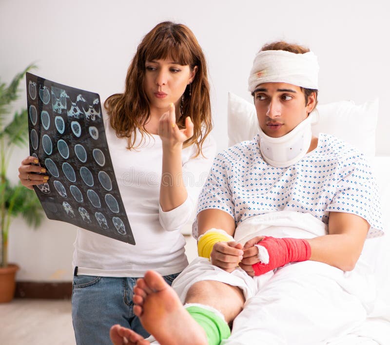 Loving Wife Looking after Injured Husband Stock Image - Image of ...