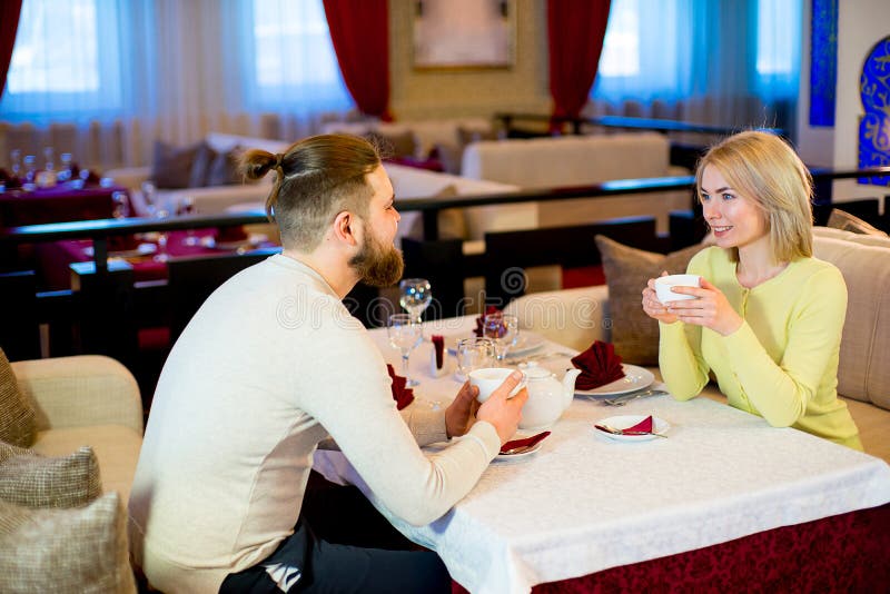 Loving Young Couple Drinking Tea in the Restaurant Stock Image - Image ...