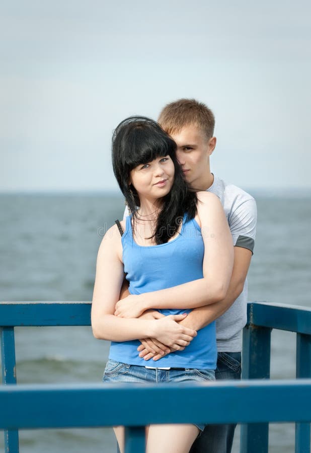 Loving young couple at sea stock photo. Image of couple - 27928584