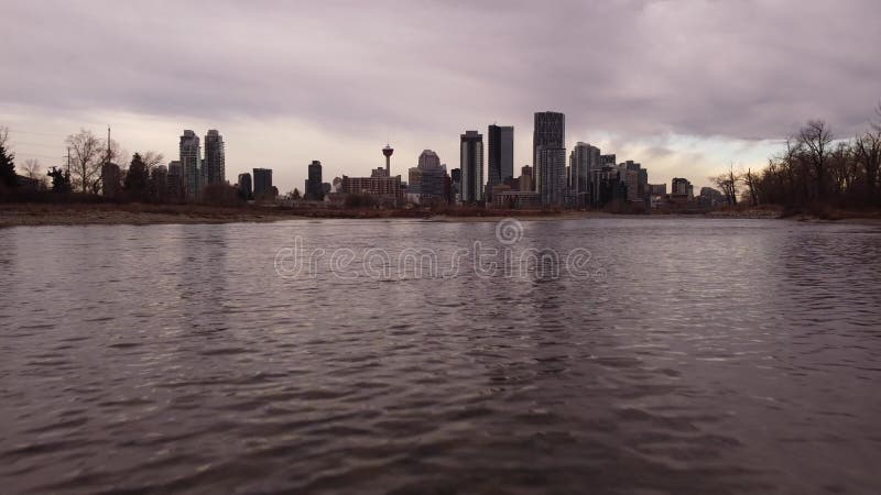 Low Aerial Flight Over the Bow River and Calgary Downtown Skyline ...