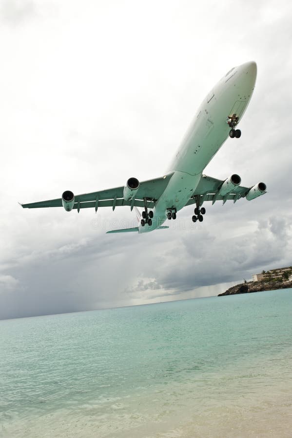 Low Airplane stock photo. Image of white, sand, ocean - 25040266