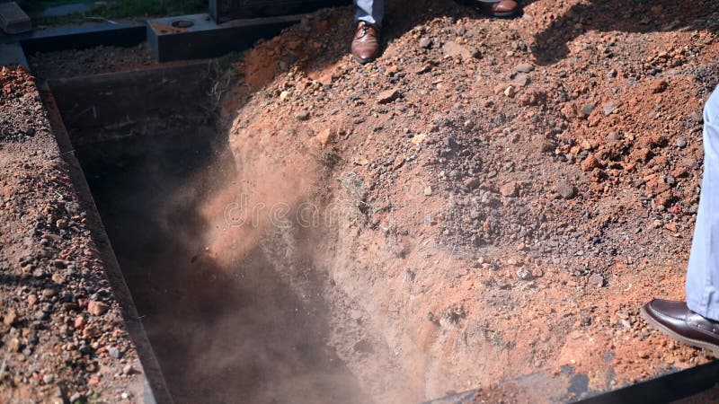 Low Angel View of People Filling Grave with Sand Stock Video - Video of ...