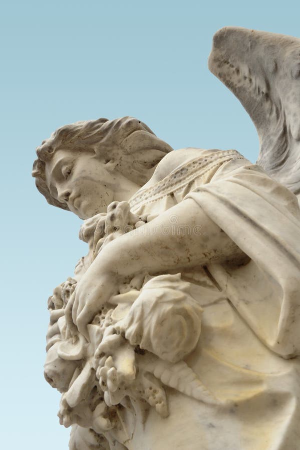 A Low Angel View of an Angel Statue Lookng Down Protectively Stock ...