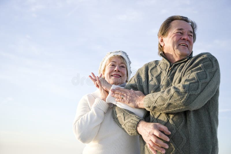 Low Angle of Affectionate Mature Couple Arm in Arm Stock Photo - Image ...