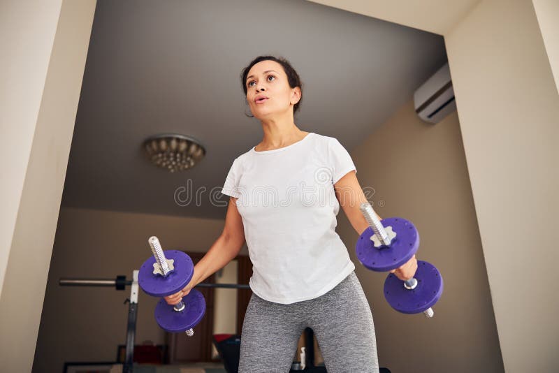 Strong Young Woman Exercising with Hand Weights Stock Photo - Image of ...