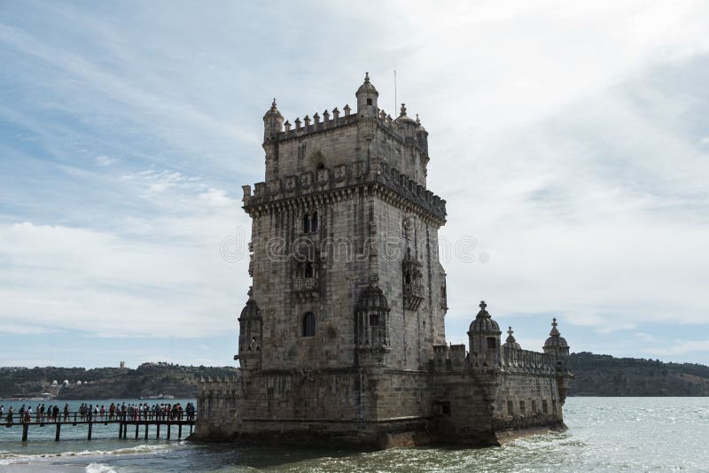 Low-angle of Belem Tower with a Seascape View with a Cloudy, Sunlit Sky ...