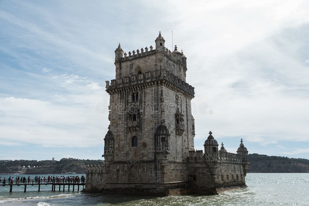 Low-angle of Belem Tower with a Seascape View with a Cloudy, Sunlit Sky ...
