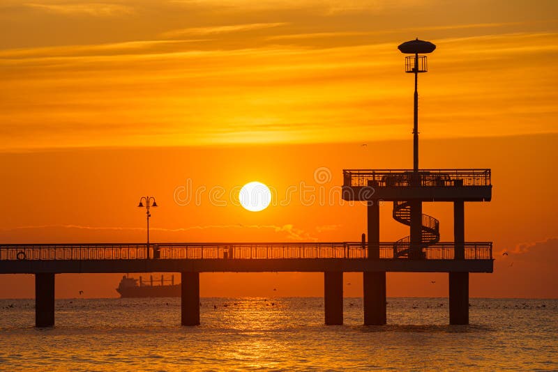 Low-angle of a Boardwalk with the Seascape View at Sunset, Water ...