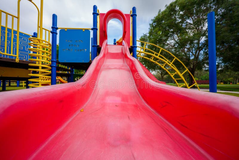 Low Angle Bottom of a Park Slide Red Stock Image - Image of bottom ...