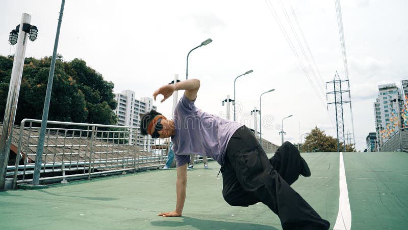 Low Angle Camera of Dancer Doing Freeze Pose while Looking at Camera ...