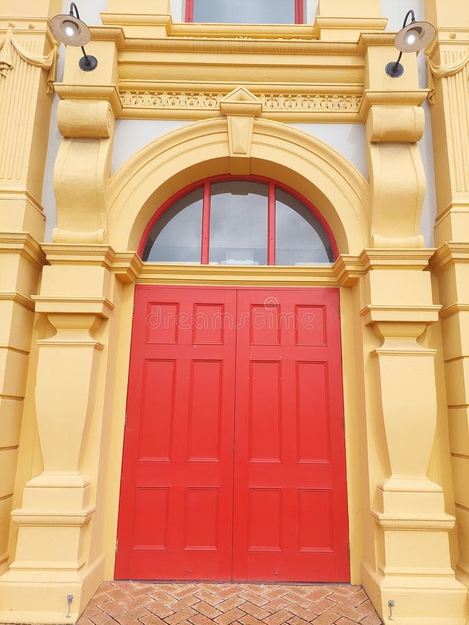 Low-angle Cartoon Red Door of the Yellow Building. Stock Image - Image ...
