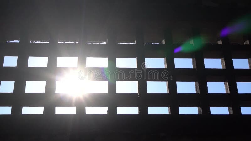 Cinematic Shot of Sun Rays Shining through the Gaps in Concrete ...
