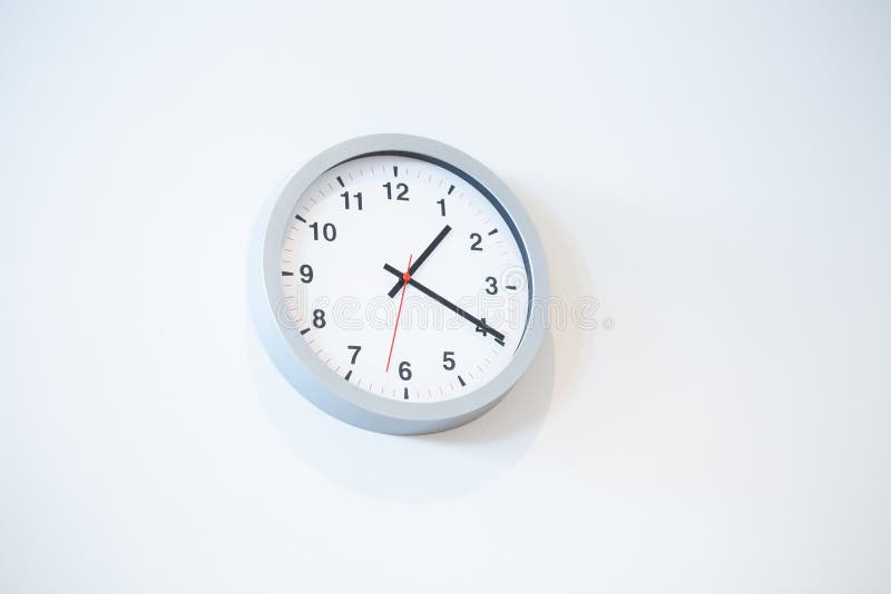 Low Angle Closeup View of a White Clock on a White Wall Stock Image ...