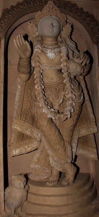 Low Angle of a Deity Sculpture in a Shrine with a Dim Lighting Stock ...