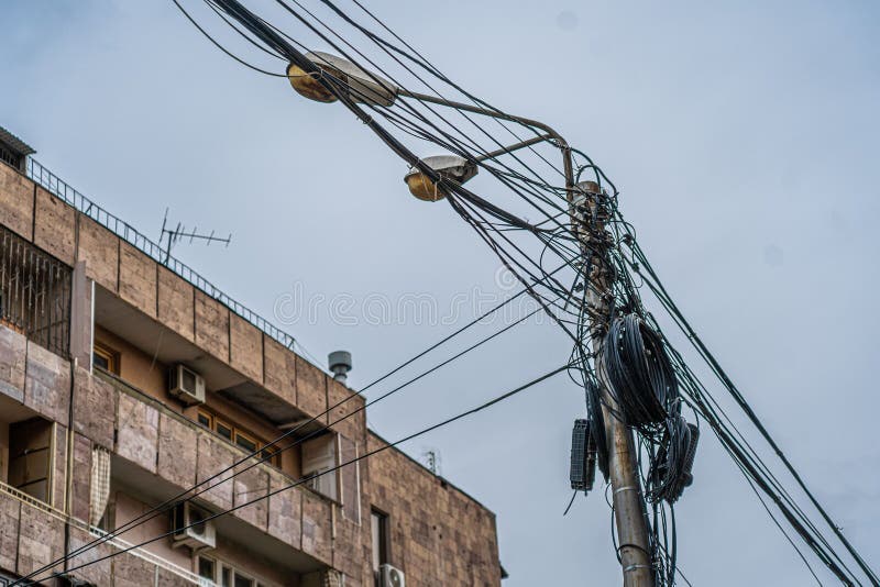Low Angle of Electric Wires on Lamp Post in Front of Building Stock ...
