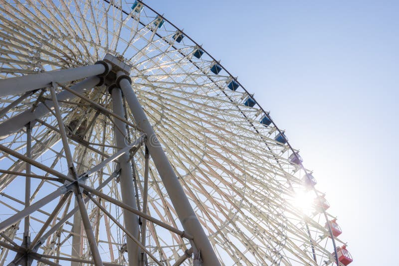 Low angle ferris wheel stock photo. Image of sunny, flare - 252700632