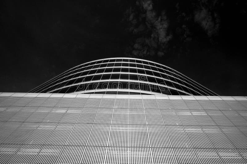 Low Angle Gray Scale Shot of a Building Under a Cloudy Sky Editorial ...