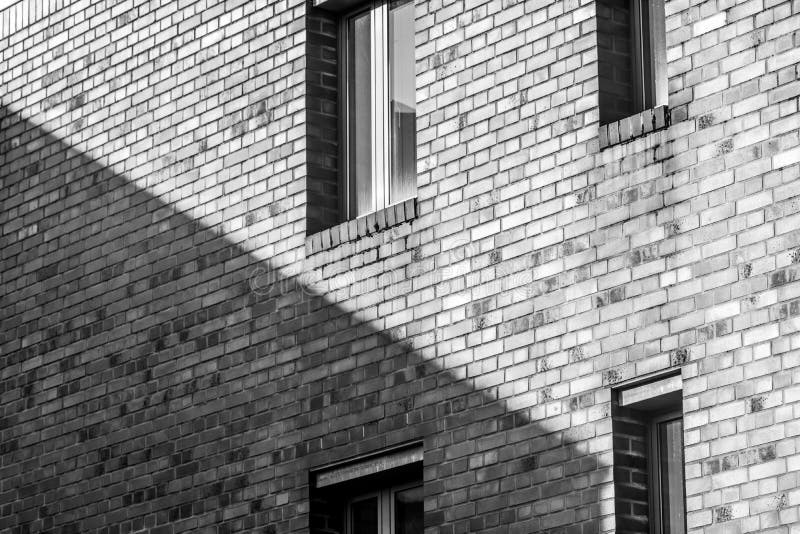 Low-angle Grayscale Shot of a Brick-built Building S Facade Under the ...