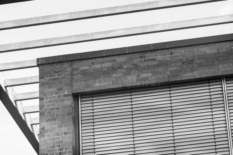 Low-angle Grayscale View of a Brick-built Building S Facade with Blinds ...