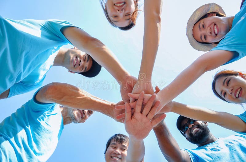 Low Angle,group of Happy Diversity People Smile,stacking Hands To ...