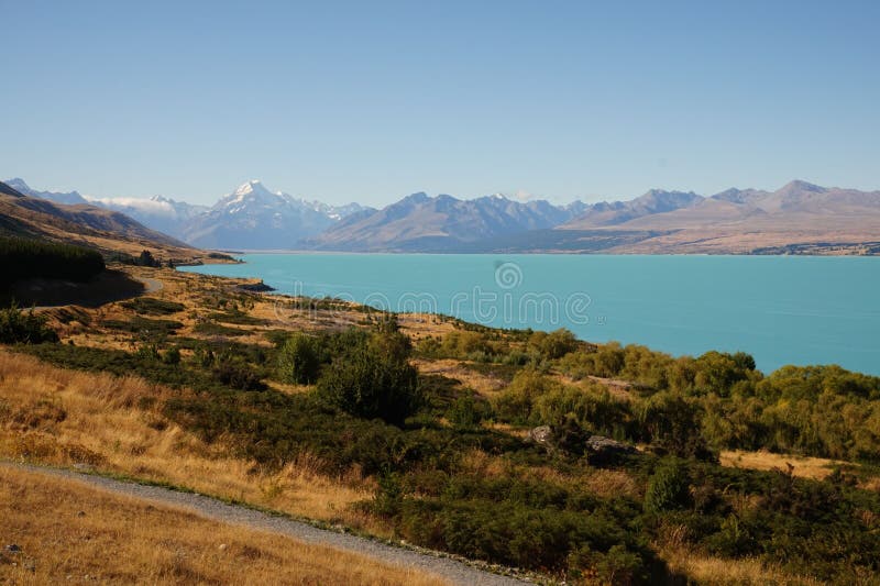 Low-angle of a Landscape with a Seascape and Beach with Grass Aoraki ...