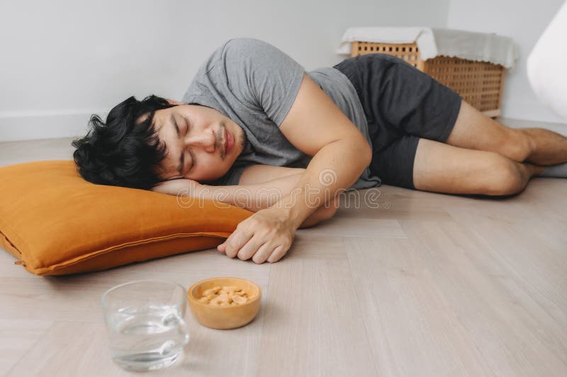 Low Angle of Man Napping on the Floor Take a Rest in the Weekend. Stock ...
