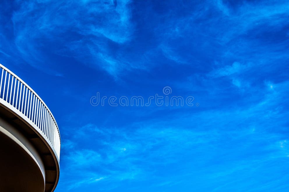 Low Angle of a Modern Round Balcony Under Blue Sky Stock Photo - Image ...